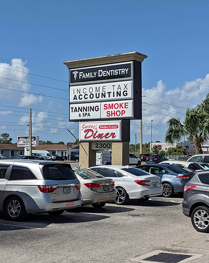 The sign that guides hungry travelers to breakfast nirvana, standing tall among palm trees like a beacon of hope for empty stomachs.