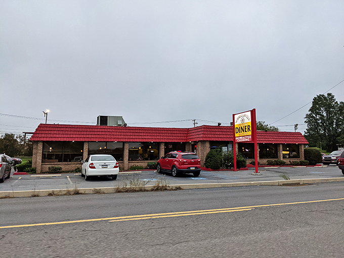 The exterior view every regular recognizes from the road. That red roof and sign have guided hungry travelers like a lighthouse for deliciousness.
