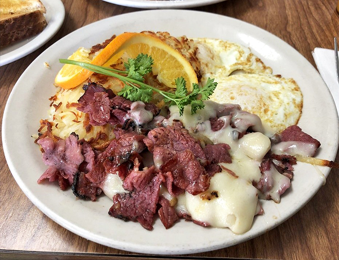 Pastrami and eggs&mdash;the breakfast of champions who plan to nap later. That melted cheese blanket turns simple ingredients into a morning masterpiece.
