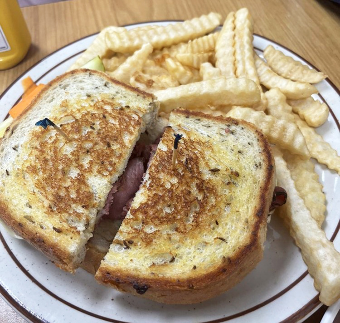Grilled sandwich perfection with golden-brown bread that makes a satisfying crunch with every bite. The fries are just showing off.