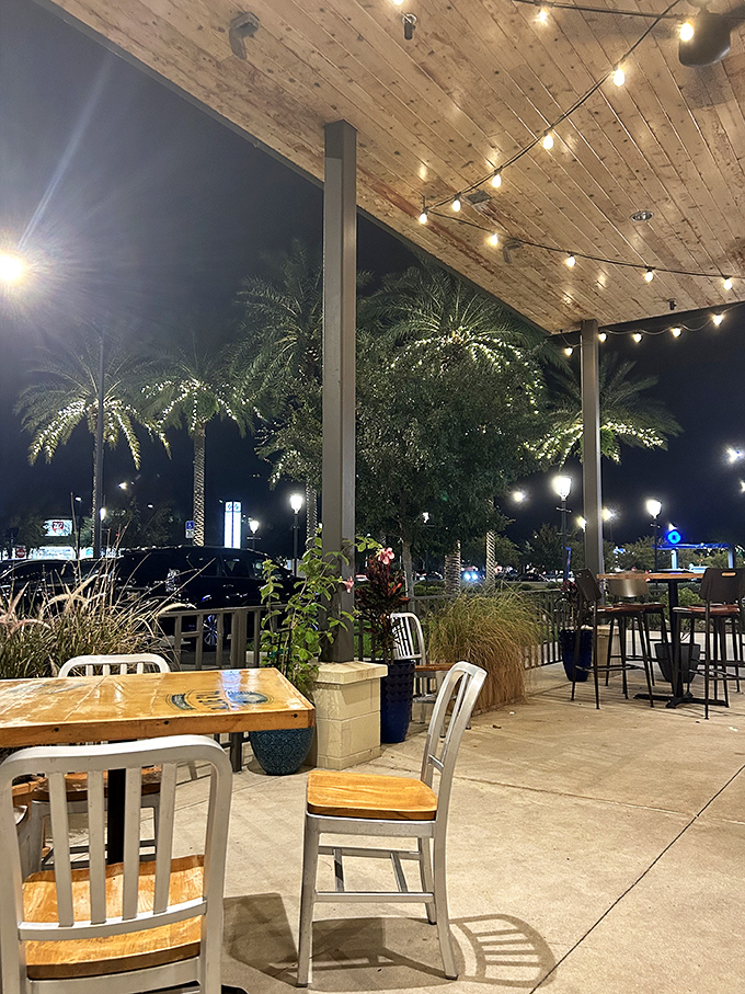 The outdoor patio, where string lights twinkle above and palm trees sway&mdash;dinner and a Florida light show all in one magical setting.