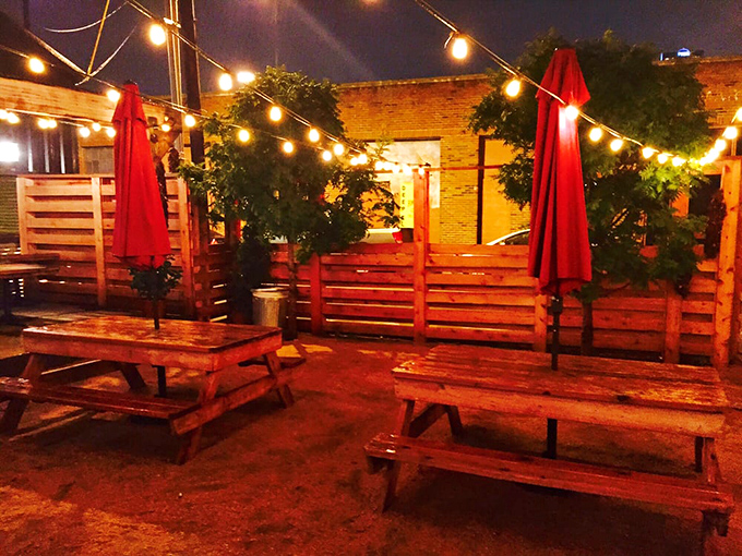 The patio at night transforms into a twinkling barbecue oasis. Where meat sweats cool under string lights and Texas stars.