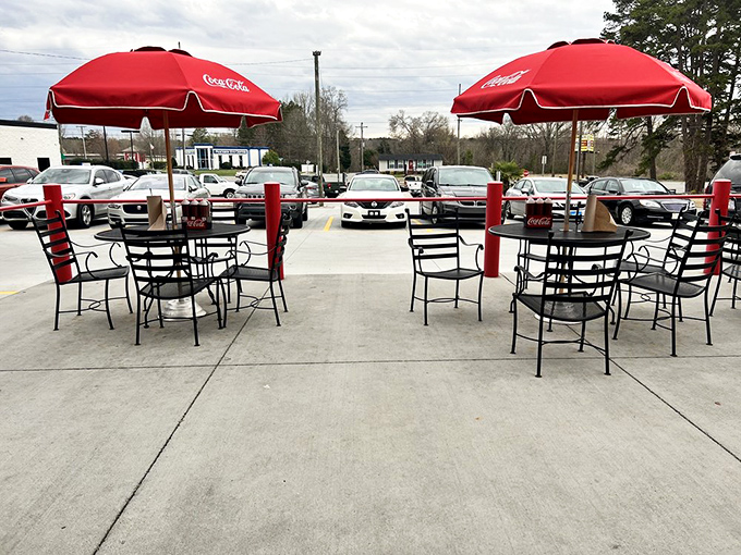 The outdoor oasis where smoke-scented dreams come true. Red umbrellas and fresh air make this patio the perfect spot for barbecue contemplation.