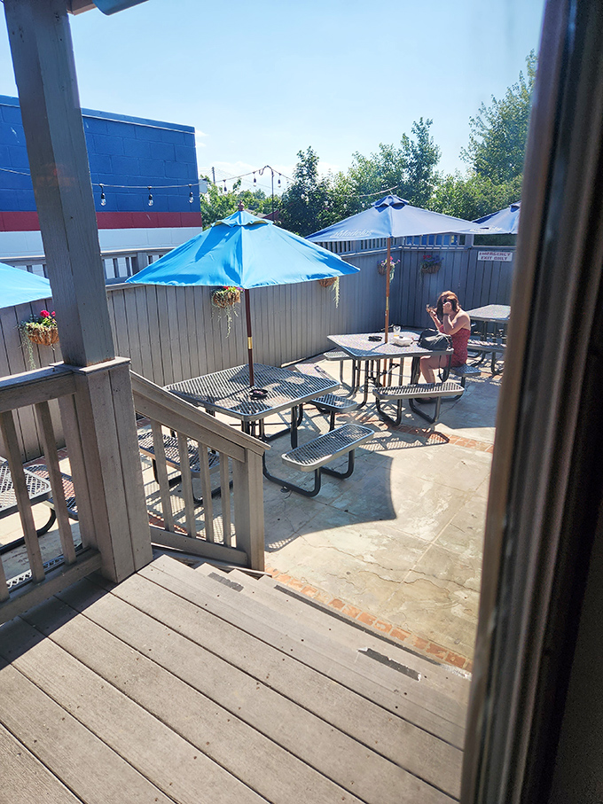 The outdoor patio&mdash;where summer afternoons stretch into evenings, and strangers become friends over shared plates and cold drinks.