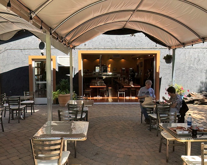 The covered patio area offers a peaceful retreat for BBQ contemplation. Indoor comfort meets outdoor freshness &ndash; the best of both worlds.