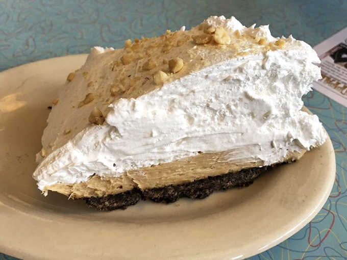 Peanut butter pie so light it might float away if not anchored by that chocolate crust. The walnut sprinkle adds just the right crunch to this cloud-like creation.