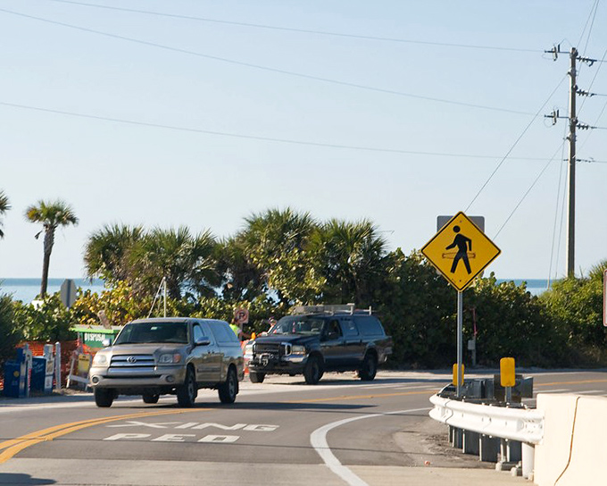 The main road whispers, "Slow down, you're on island time now," as palm trees stand guard between visitors and their everyday worries.