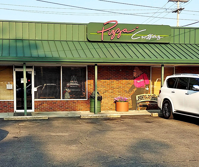 Pizza Crossing has been satisfying Logan's cravings for decades, where the familiar green awning signals comfort food that won't break your retirement budget.