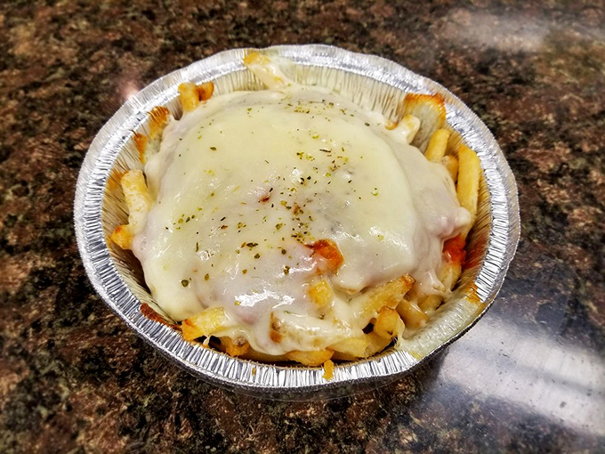 Pizza fries: where two perfect foods collide in a aluminum dish of melty, carb-loaded bliss. Diet plans, beware.