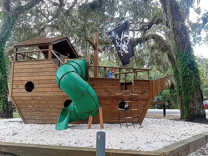 A pirate ship playground where kids burn energy while parents burn through another slice of key lime pie. Fair trade.
