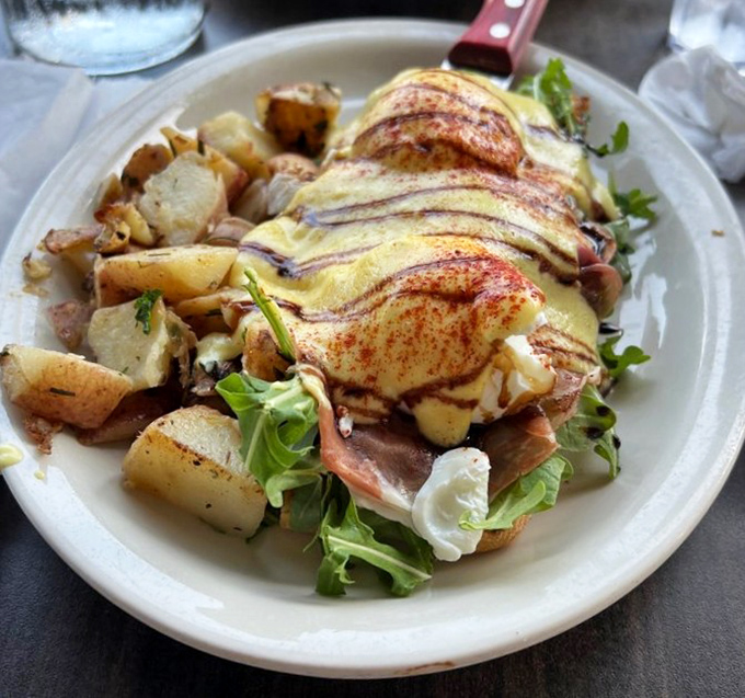 The Pope's Benedict—a heavenly creation that proves eggs can indeed be divine when blessed with prosciutto and hollandaise.