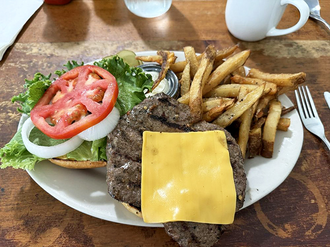 The Powerman's Burger isn't just a meal&mdash;it's a commitment. A perfectly charred patty with all the fixings and hand-cut fries worth every delicious calorie.