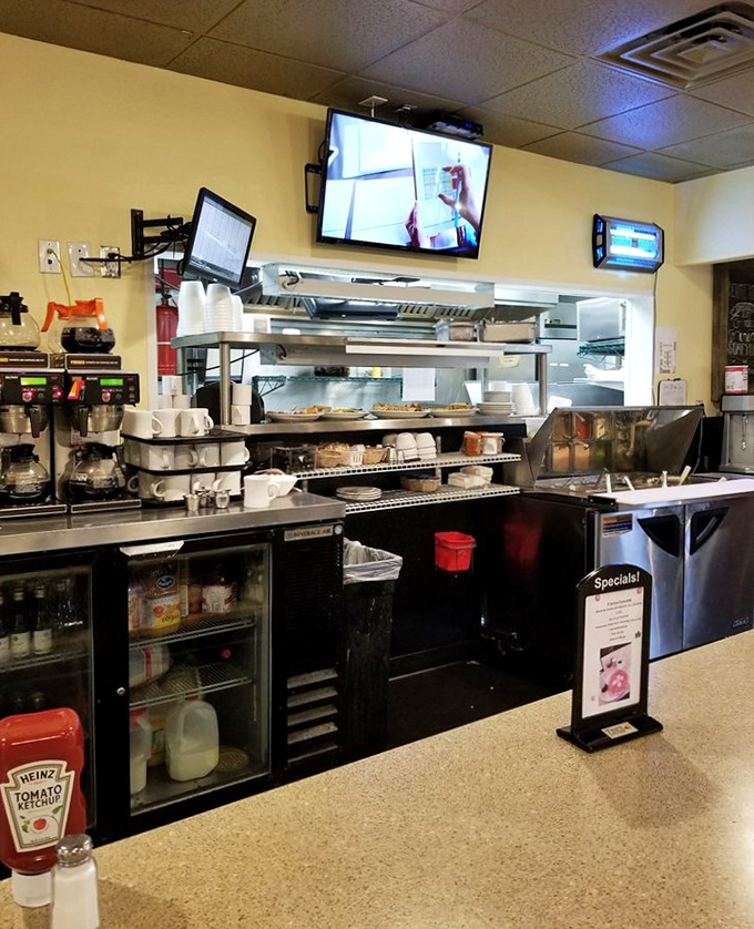 The bustling prep area reveals the organized chaos behind every perfect plate – where breakfast magic happens before your eyes.