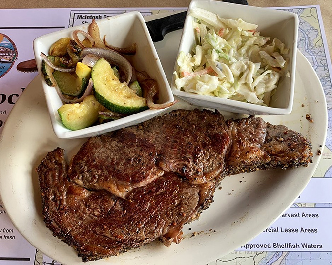 For those who insist on land-based protein, this perfectly seared ribeye with fresh sides proves The Fish Dock respects all appetites equally.