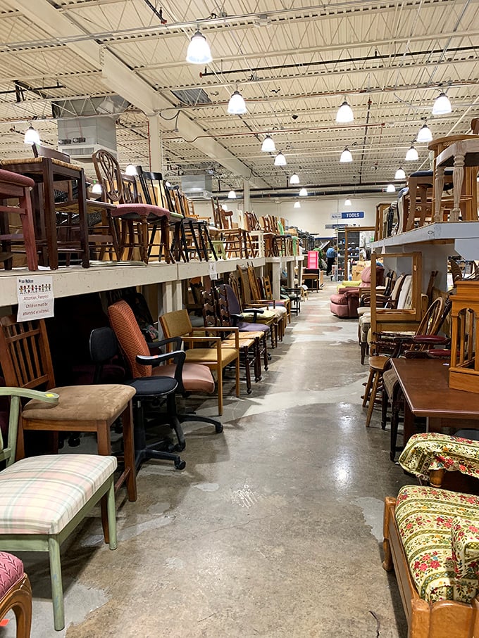 Chair parade! This aisle of seating possibilities offers everything from "distinguished professor's office" to "cozy grandmother's kitchen" aesthetics.