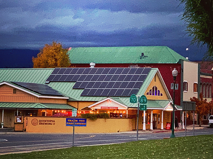 Quintopia Brewing Company glows at dusk like a beacon for thirsty travelers seeking craft beer salvation in the mountains.