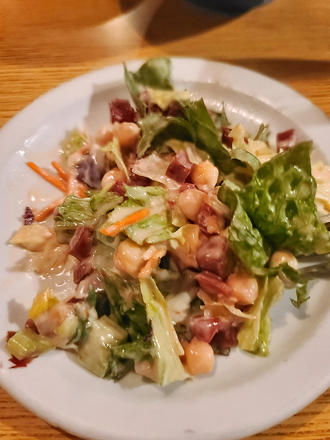 A house salad that doesn't apologize for being exactly what it should be&mdash;crisp, fresh, and ready to prepare your palate for the meaty main event.