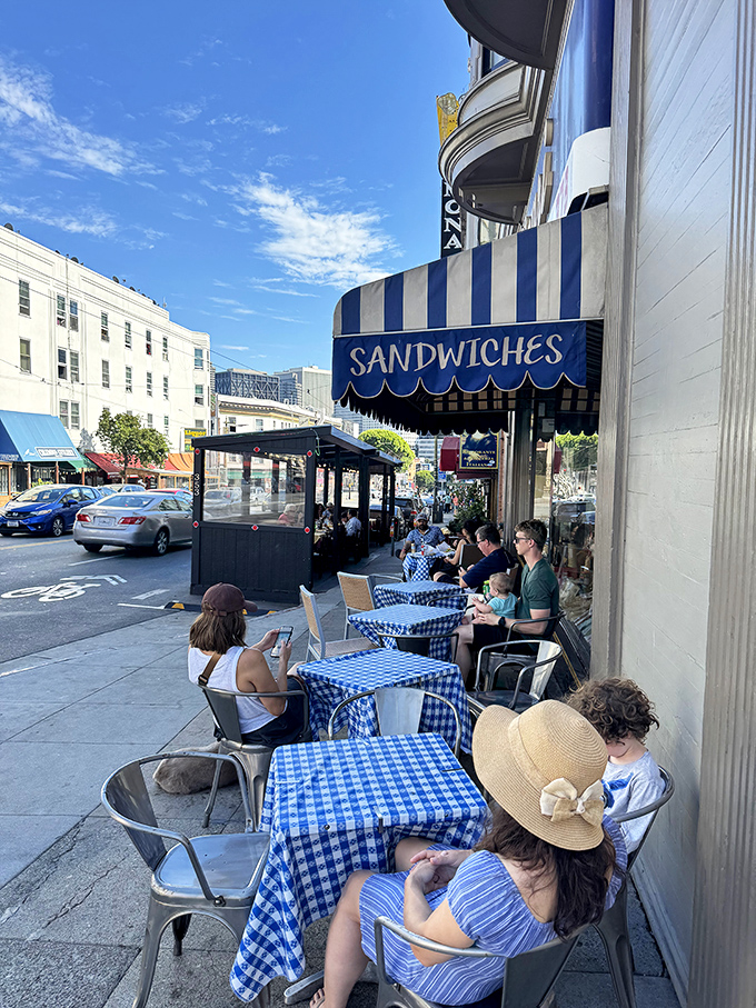 The sidewalk seating area&mdash;where strangers become friends united by the universal language of "mmm" and "you've got to try this."