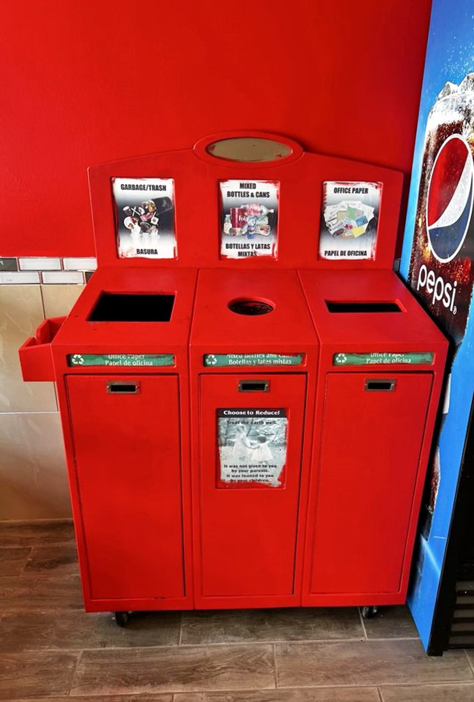 Even the trash bins match the d&eacute;cor&mdash;that's commitment to a theme. Red recycling stations: saving the planet while staying on brand.