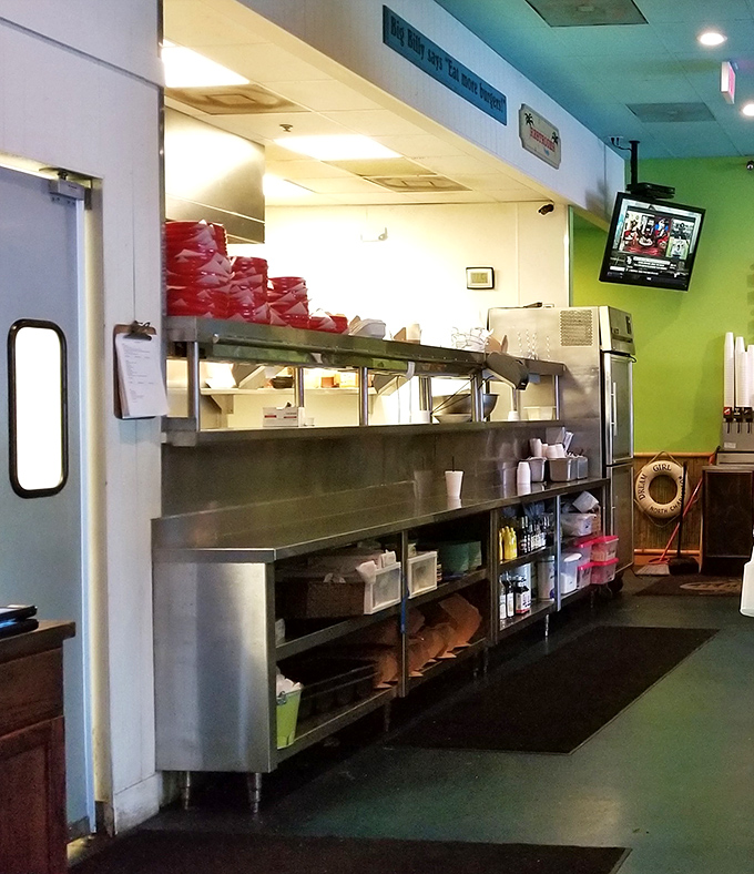 A glimpse into the kitchen where burger magic happens &ndash; stainless steel and efficiency, the engine room of flavor creation.