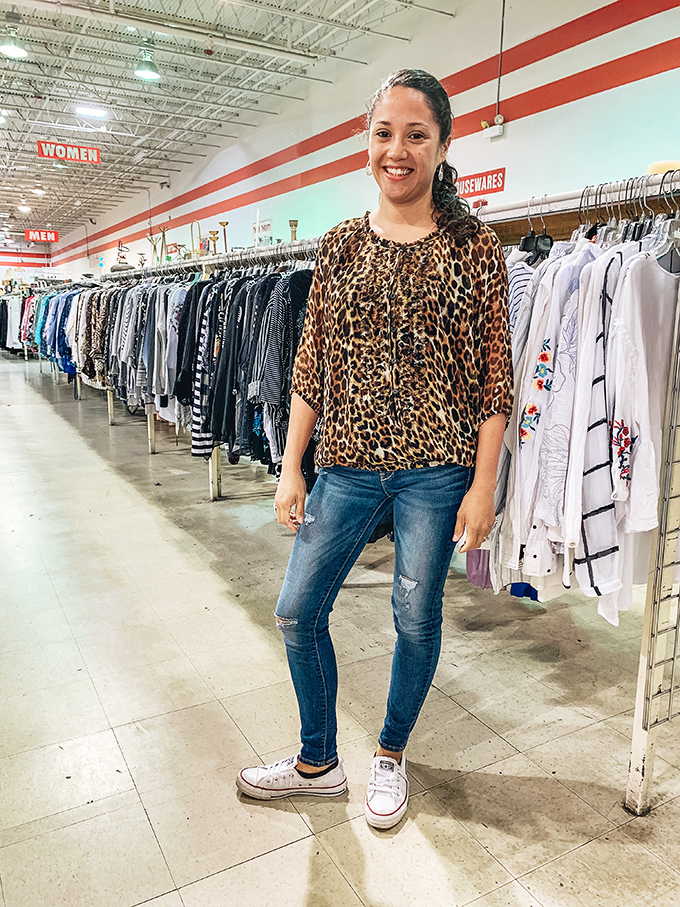 The thrift store floor becomes a runway where personal style is discovered, one pre-loved garment at a time.