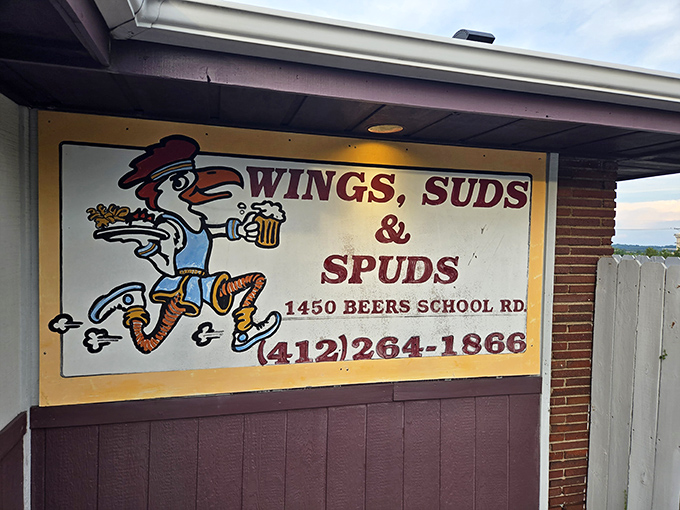 The sign says it all: Wings, Suds & Spuds. Sometimes the simplest names tell you exactly what you need to know about paradise.