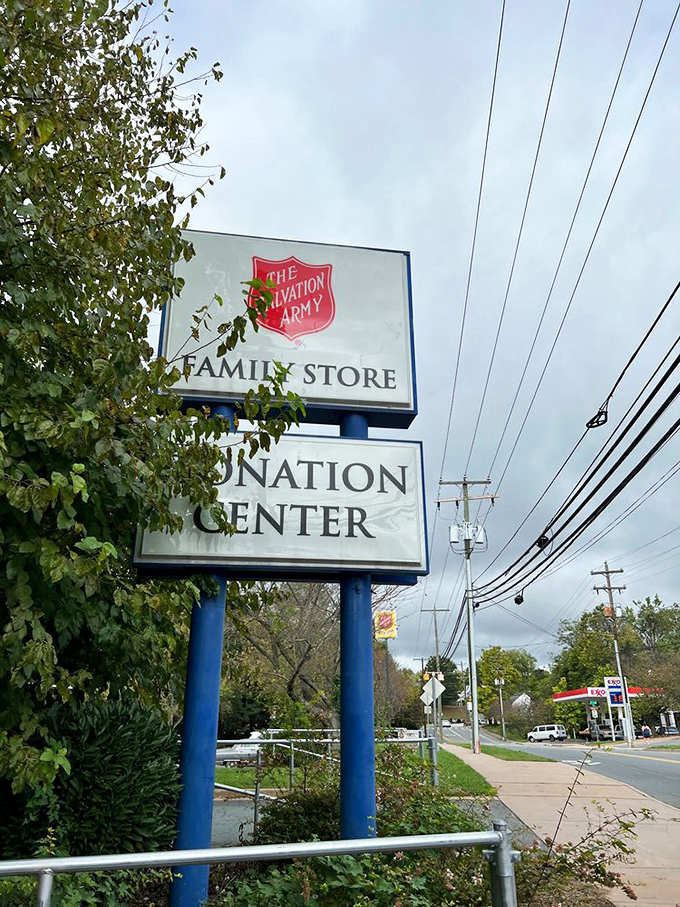 The beacon of bargains: where the Salvation Army sign promises both treasures inside and the warm glow of knowing your purchase helps others.