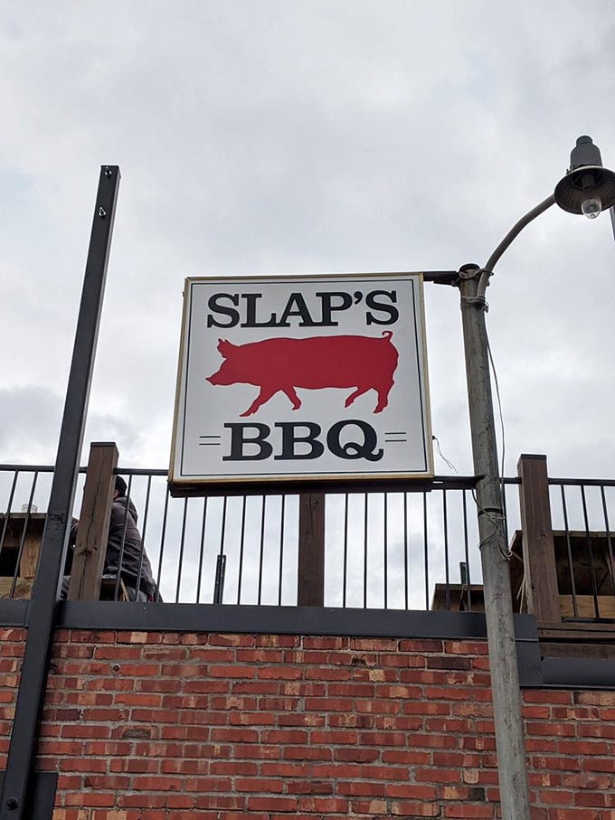 The iconic Slap's sign featuring their pig silhouette – a simple promise of porcine perfection that draws barbecue pilgrims from miles around.