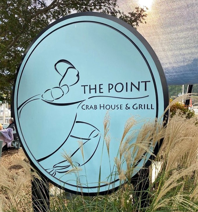 The sign says it all &ndash; a crab silhouette promising seafood salvation. Those waving grasses are nature's way of pointing you toward dinner.