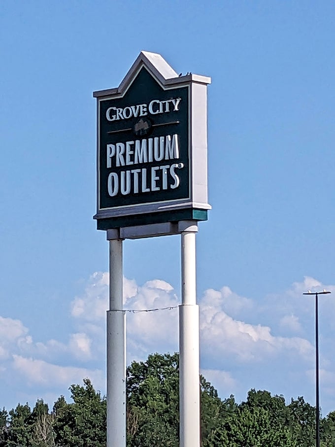 The beacon of bargains against Pennsylvania sky. This sign has guided more shopping pilgrimages than any GPS ever could.