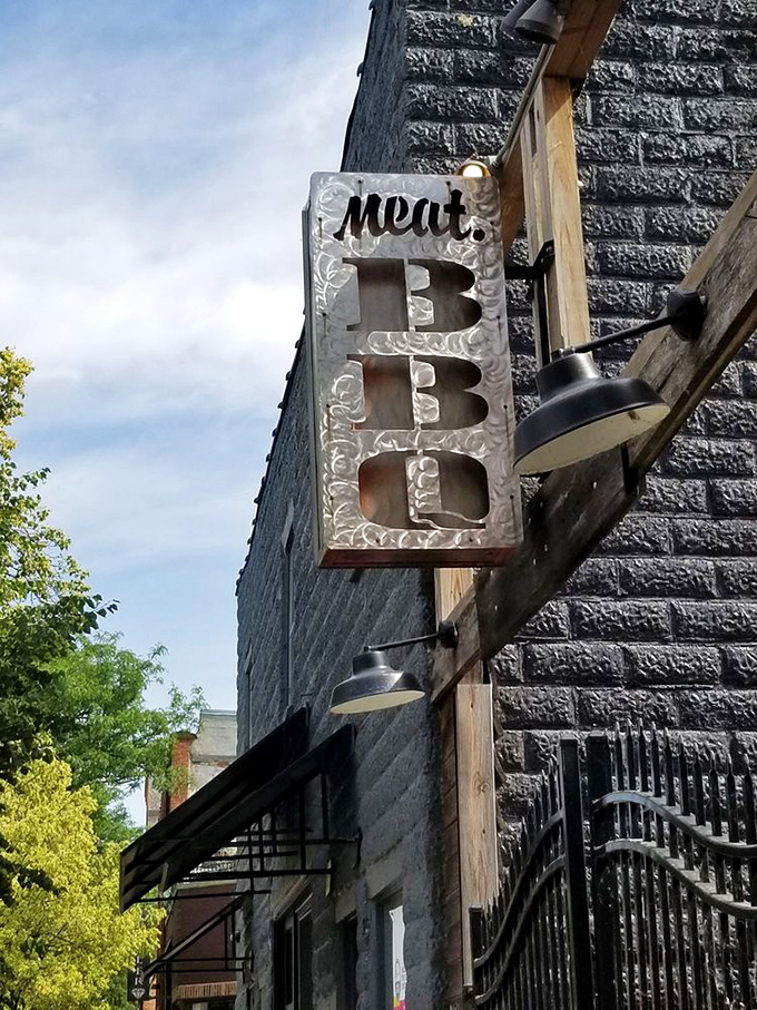 The sign says it all &ndash; three simple letters that promise everything a carnivore could want, hanging proudly against Lansing's skyline.