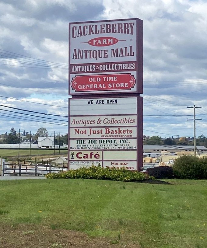 The roadside beacon for treasure hunters! This sign promises not just antiques but an experience &ndash; the "Old Time General Store" nostalgia we secretly crave in our digital world.