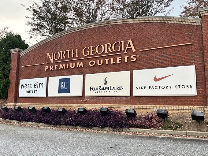 The entrance sign proudly announcing your arrival at the promised land of retail therapy and budget-friendly designer finds.