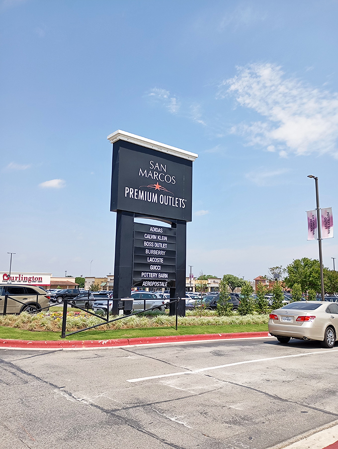 The marquee that launches a thousand shopping sprees &ndash; San Marcos Premium Outlets sign standing tall, a beacon to bargain hunters across the Lone Star State.