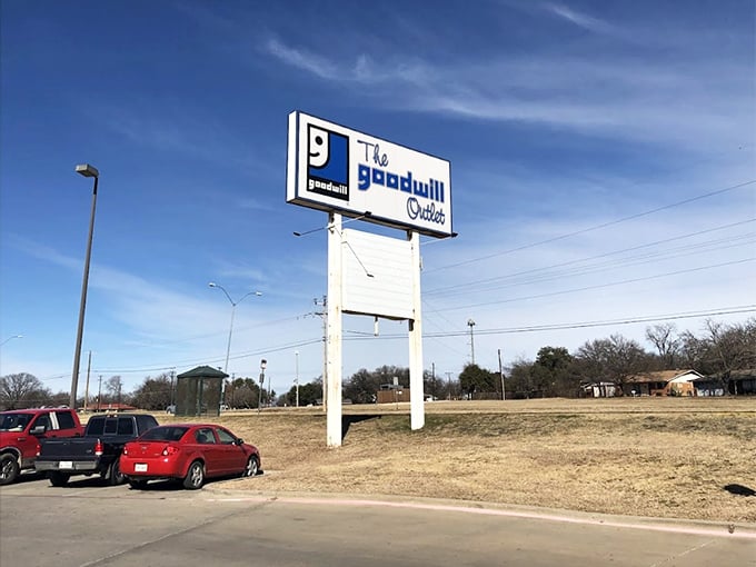 Standing tall against the Texas sky. The Goodwill Outlet sign serves as a beacon for bargain hunters and sustainability champions throughout Fort Worth.