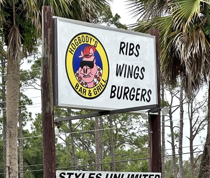 The roadside sign that promises exactly what you'll get – no false advertising, just ribs, wings, and burgers that deliver on every syllable.