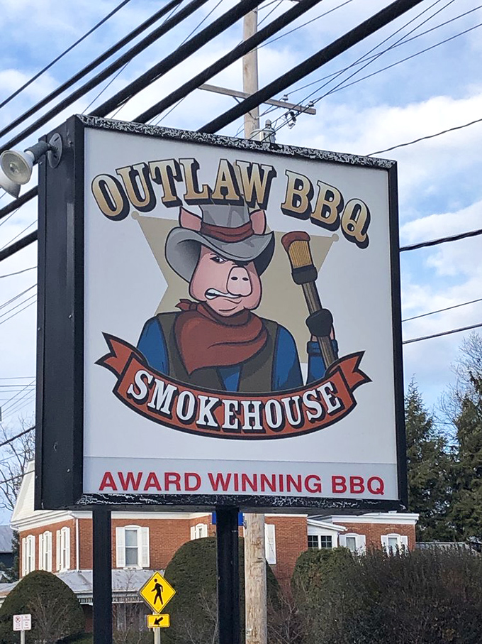 That iconic outlaw pig sign stands as a beacon of hope for the hungry, promising smoky salvation just steps away.