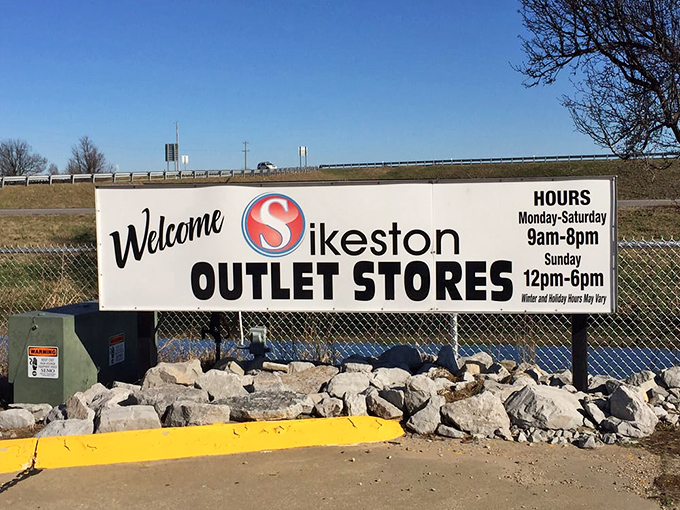 The welcoming sign that promises retail therapy seven days a week. Your bargain-hunting adventure starts with this blue-sky invitation!