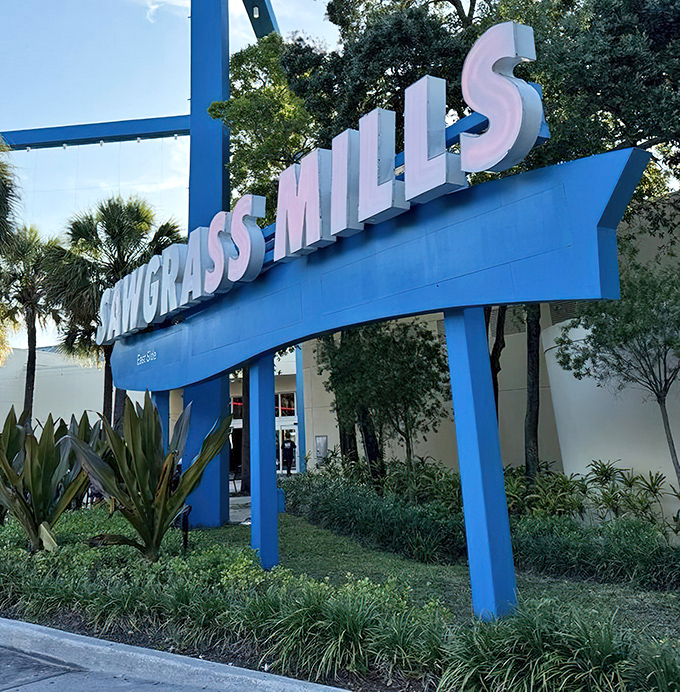 The blue Sawgrass Mills sign: Florida's version of retail paradise's pearly gates, welcoming shoppers to their happy place.