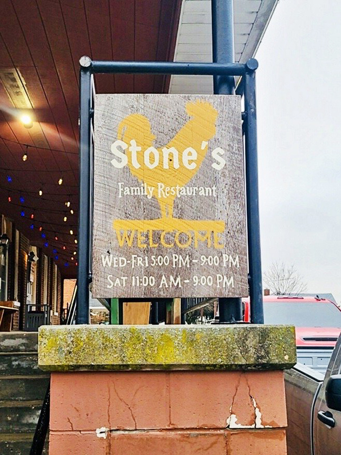 The rooster sign stands as a beacon of hope for hungry travelers. Follow the chicken to find the chicken&mdash;it's just good logic.