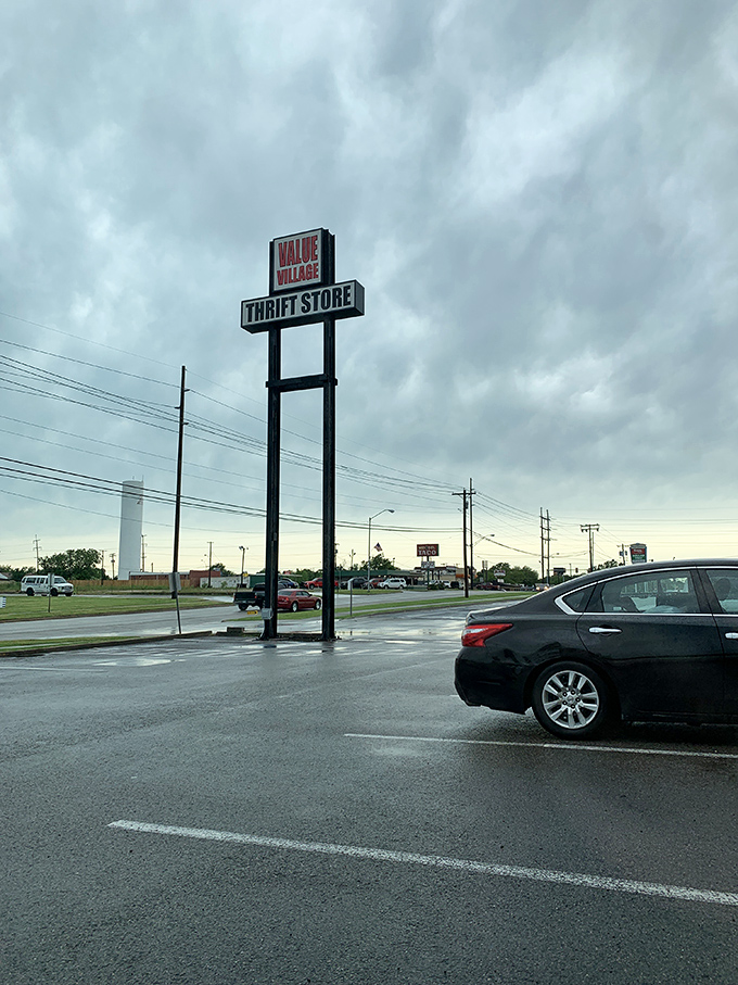 The towering sign stands sentinel in the parking lot, a beacon for bargain hunters navigating Del City's retail landscape.