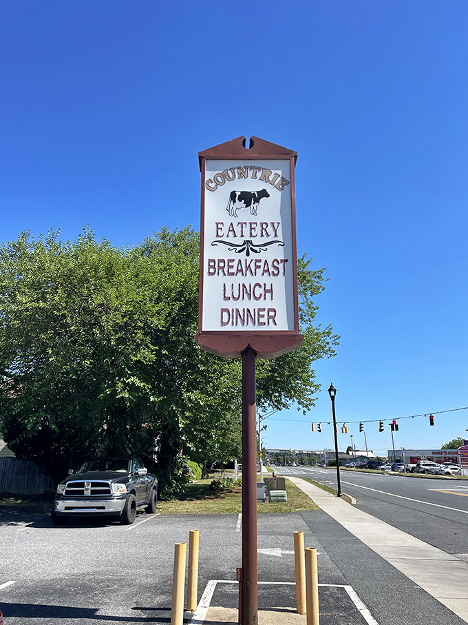 The roadside sign stands tall, featuring the restaurant's bovine mascot – a beacon for hungry travelers seeking breakfast bliss in Dover.