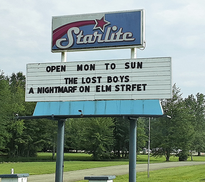 That vintage sign with its star emblem promises entertainment seven days a week. Even the typo in "Elm Street" adds to its retro charm.