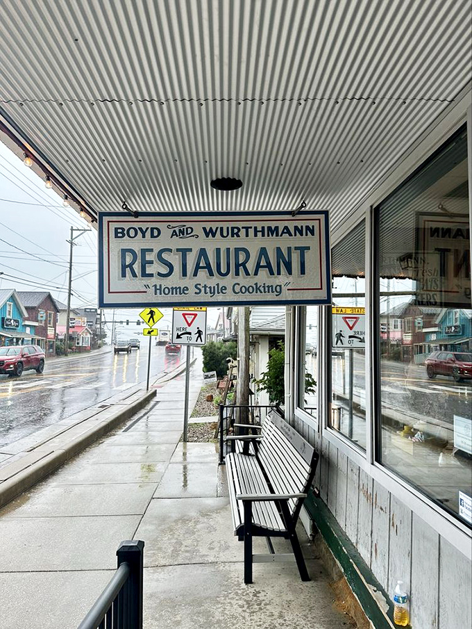 Even in the rain, this sign shines like a beacon to hungry travelers. The promise of "Home Style Cooking" has never felt more welcome.