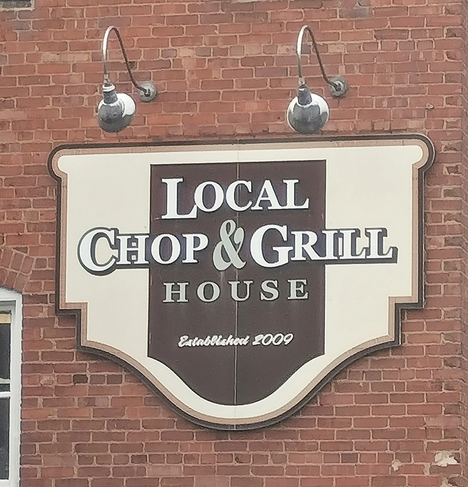 Established in 2009, but timeless in execution. This classic signage against weathered brick perfectly captures the restaurant's blend of tradition and contemporary flair.