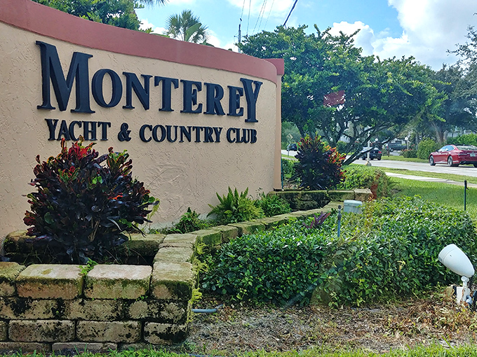 The entrance sign: your first clue that "yacht club" and "affordable" can surprisingly exist in the same Florida zip code.
