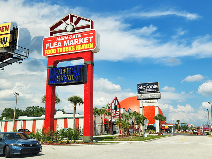 That iconic red sign announces you've arrived at bargain paradise—where food trucks and flea market finds await under Florida's blue skies.