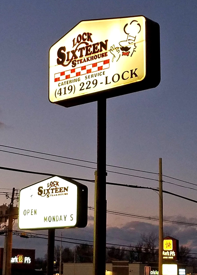 The illuminated sign stands as a beacon for hungry travelers, promising satisfaction and perhaps the beginning of a delicious tradition.