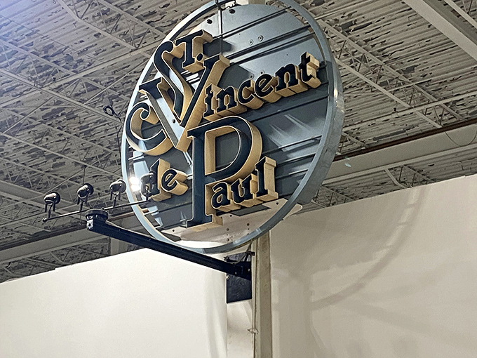 The golden seal of thrift approval! St. Vincent de Paul's elegant signage reminds shoppers their purchases support community programs.