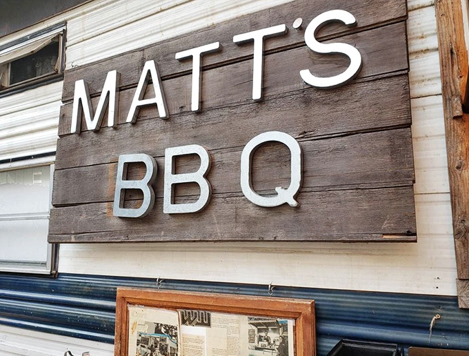Simple signage that promises so much. Those white letters against weathered wood tell you everything you need to know about Matt's priorities.